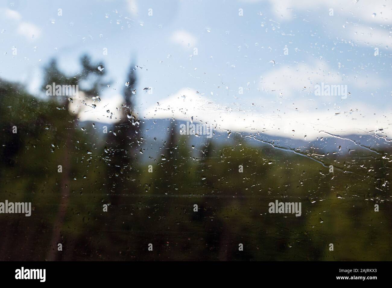 Car window with rain drops. Driving in rain. Weather background. Rainy ...