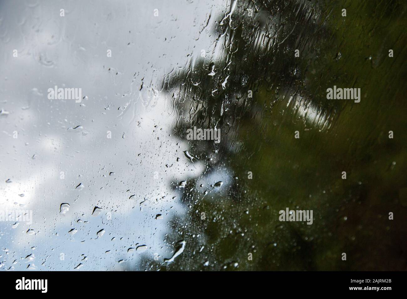 Car window with rain drops. Driving in rain. Weather background. Rainy ...