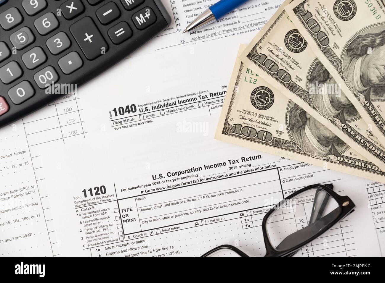 US tax form on desk composition. Tax income concept Stock Photo - Alamy