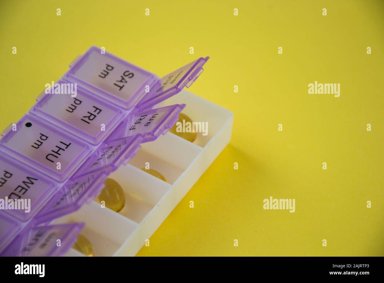 Purple box, container or organizer for pills for each day of the week ...