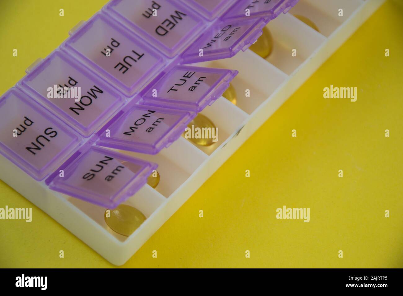 Purple box, container or organizer for pills for each day of the week ...