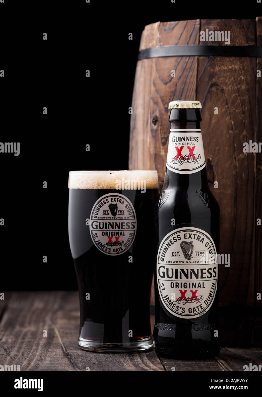 LONDON, UK - APRIL 27, 2018: Bottle and original glass of Guinness ...