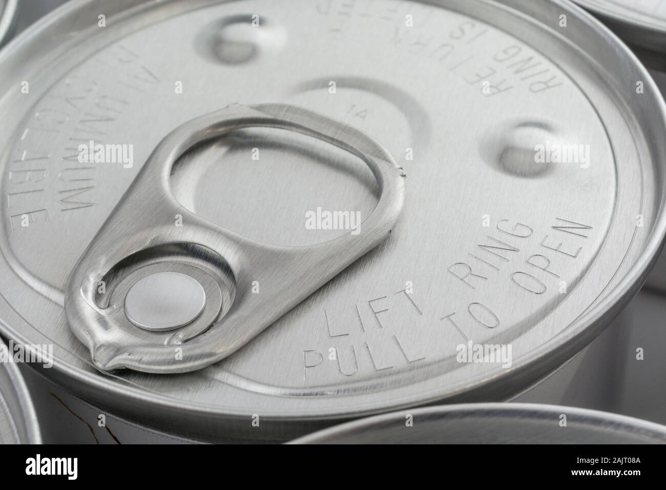 Close-up shot of brushed aluminium ring pull tab on an easy open tin of ...