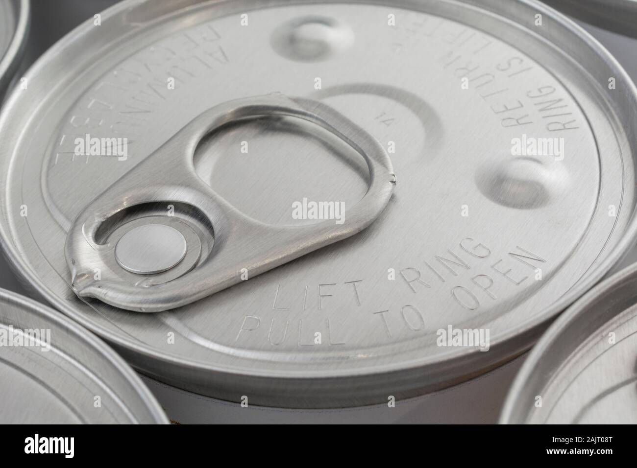 Close-up shot of brushed aluminium ring pull tab on an easy open tin of ...