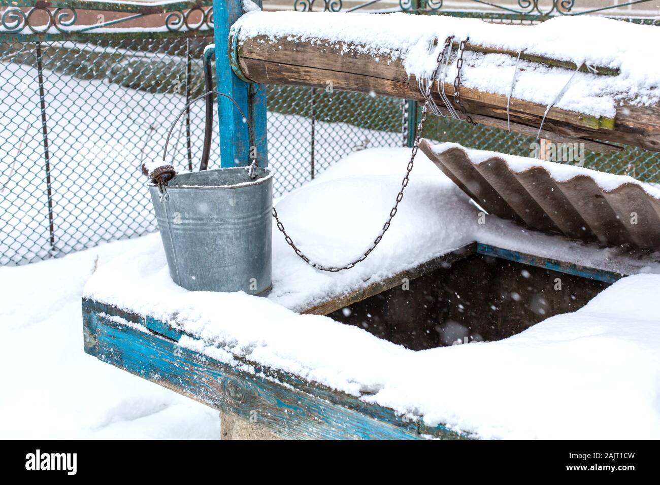 Winter. An old water well is covered in snow Stock Photo - Alamy