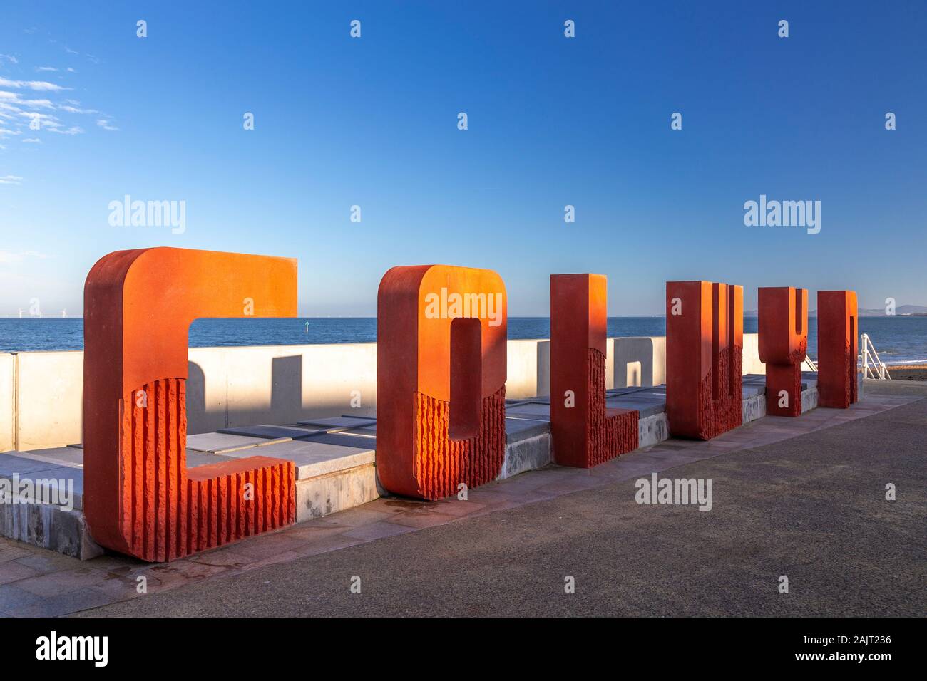Red concrete Colwyn sign at Colwyn Bay, North Wales coast Stock Photo ...