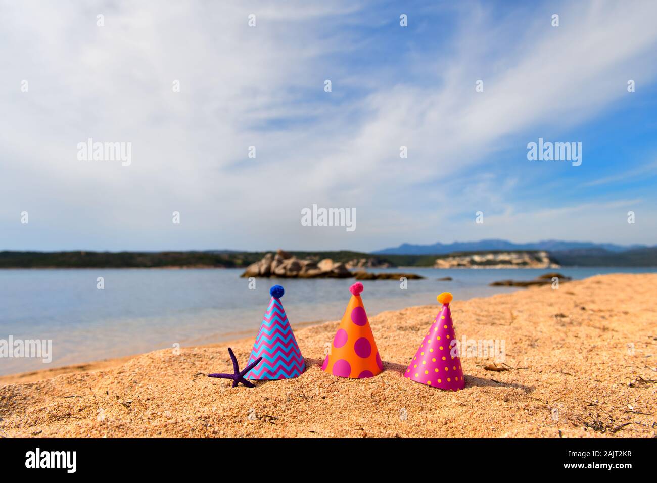 Colorful party hats at the beach Stock Photo - Alamy