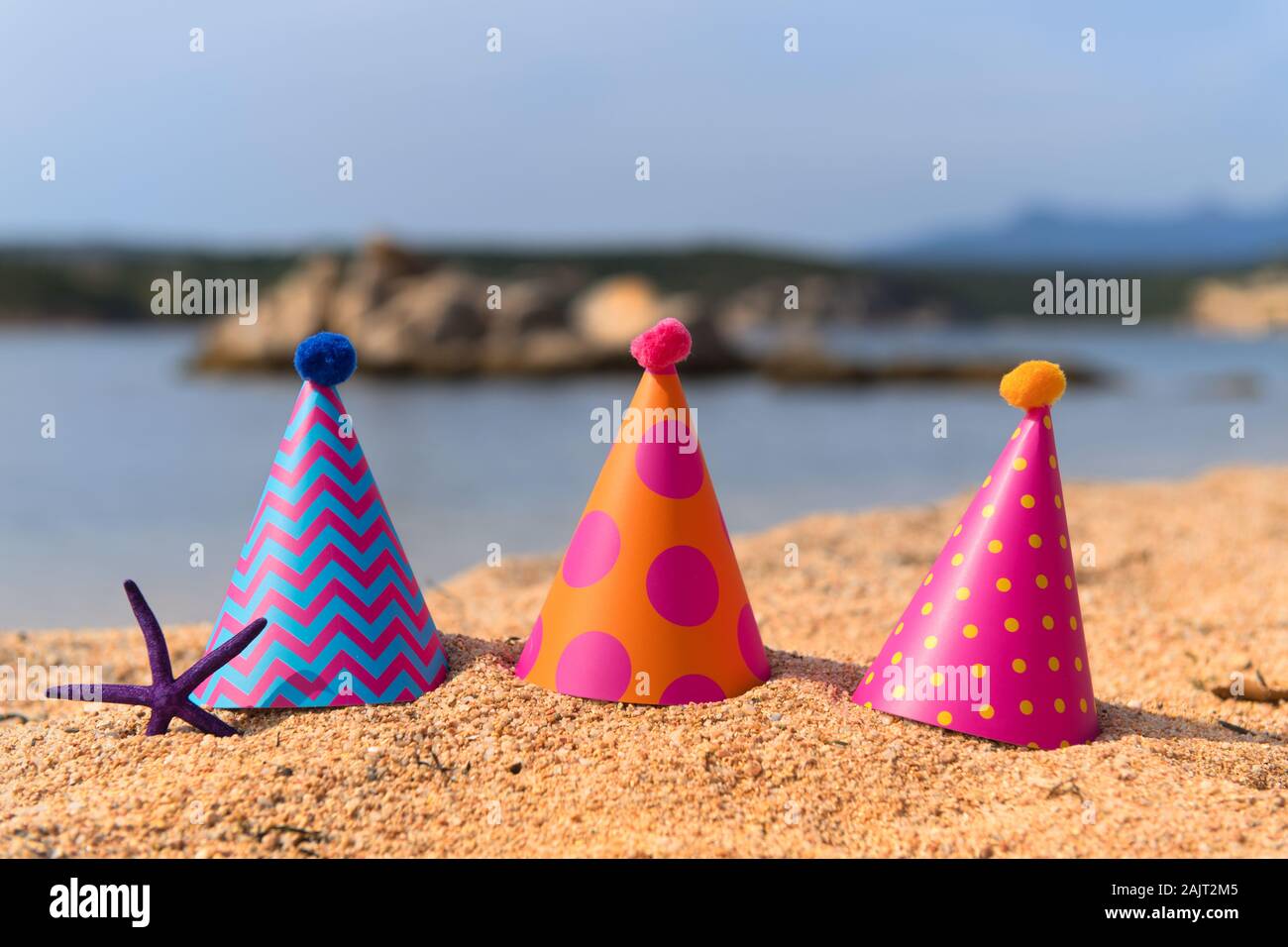 Colorful party hats at the beach Stock Photo - Alamy