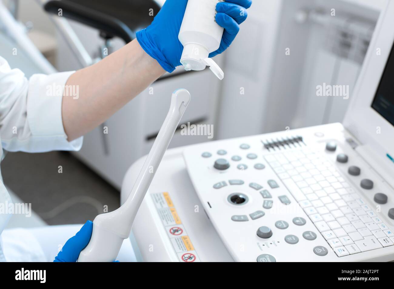 gynecologist doctor prepares an ultrasound machine for the diagnosis of ...