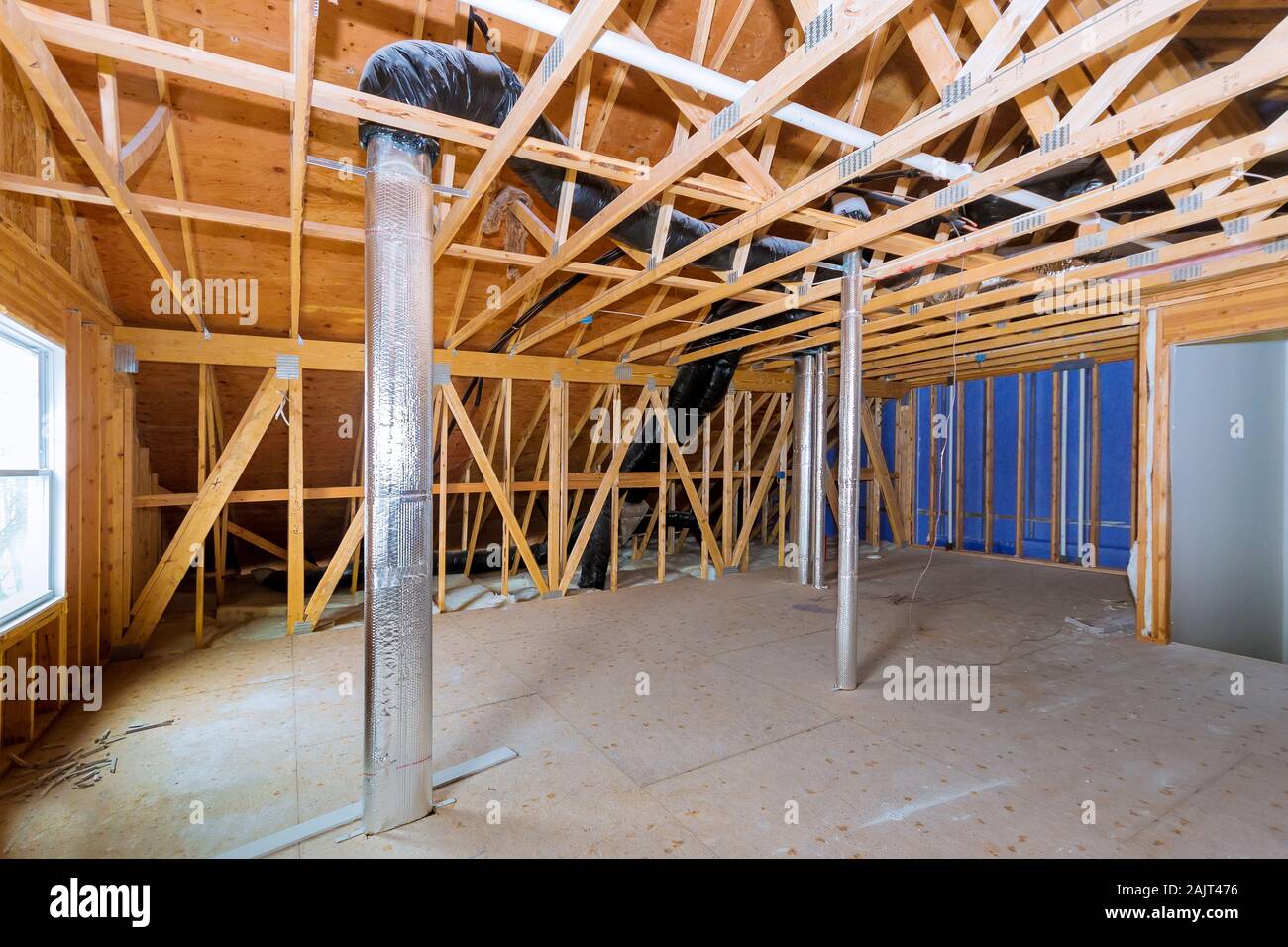 Frame house roof of pipe heating system, house attic under construction ...