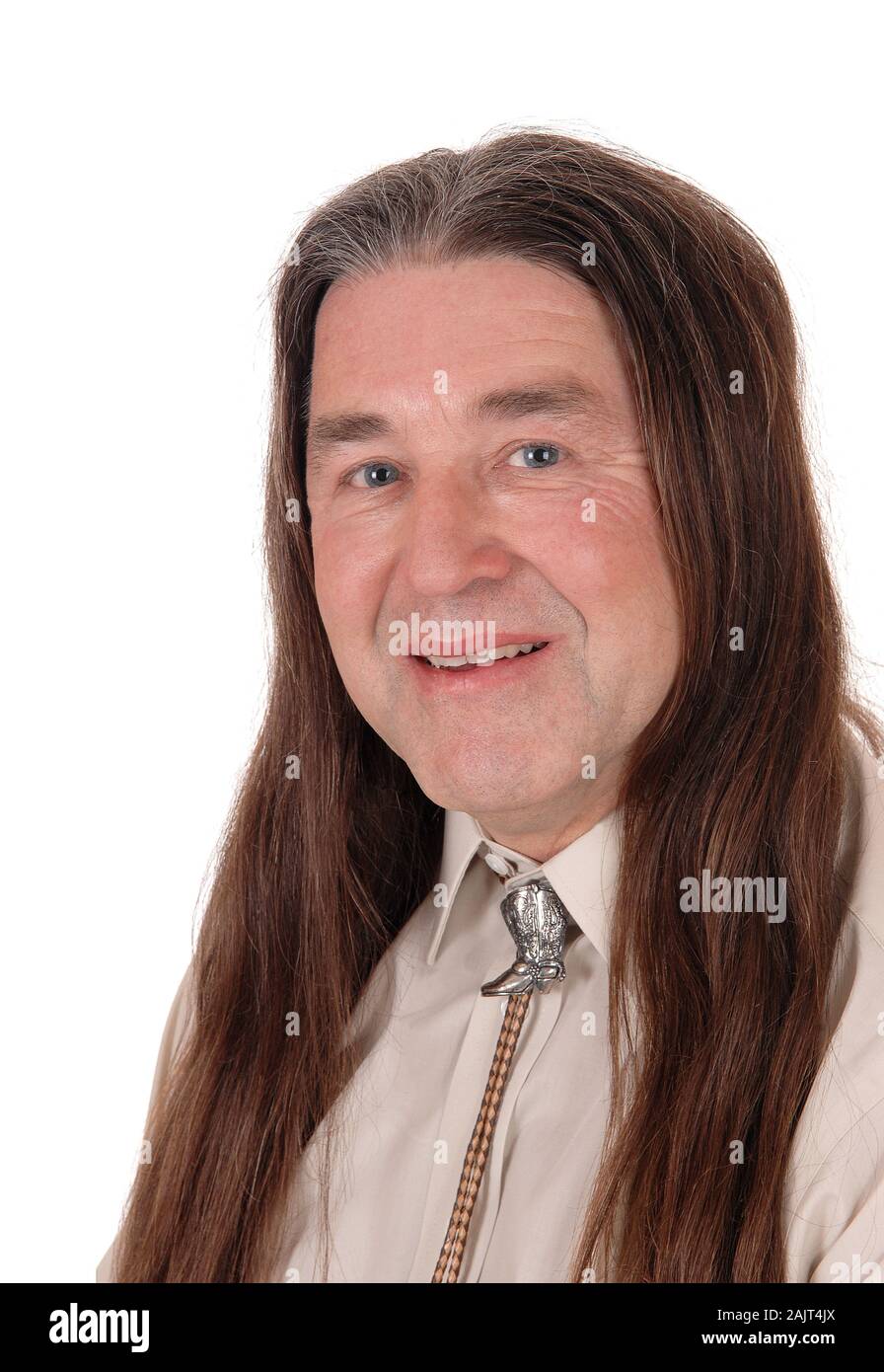 A handsome indigenous man smiling in a portrait shoot with his long ...