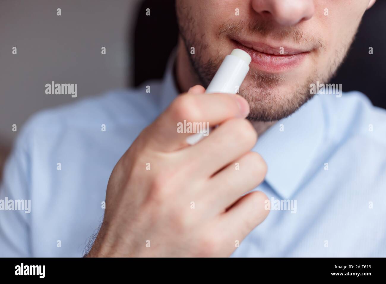 Man applying lip balm hi-res stock photography and images - Alamy