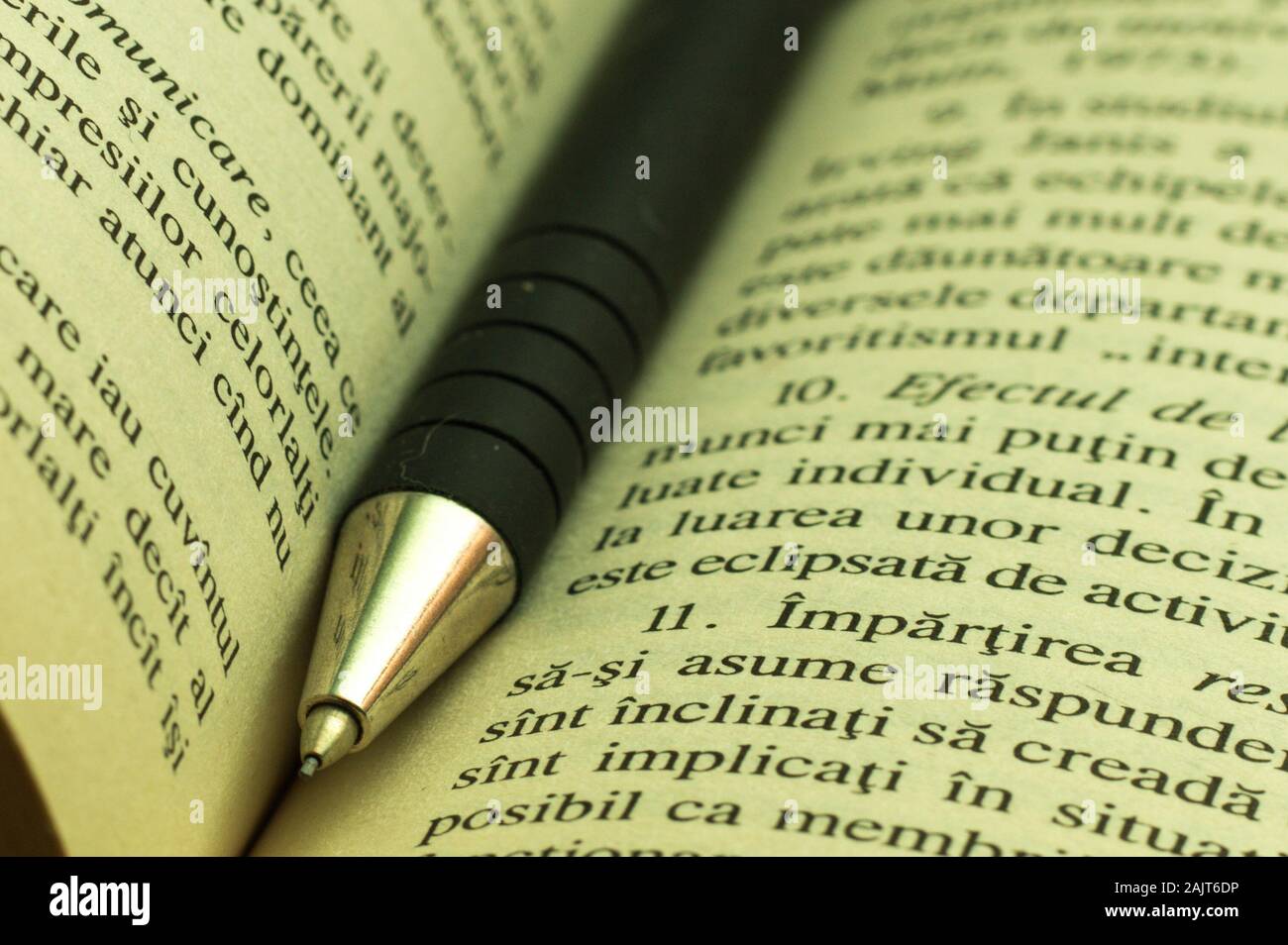 Book with a pen on the desk Stock Photo - Alamy