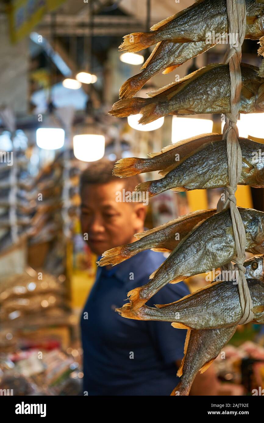 Dried fish hang in front of a fish monger at Gwangjang Market in Seoul ...