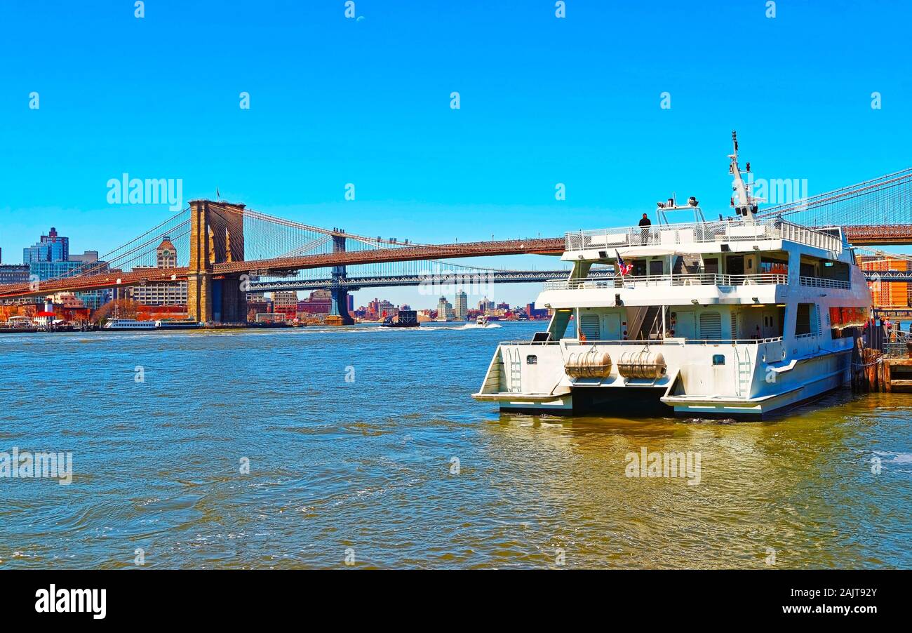 Ferry and Brooklyn bridge across East River reflex Stock Photo - Alamy