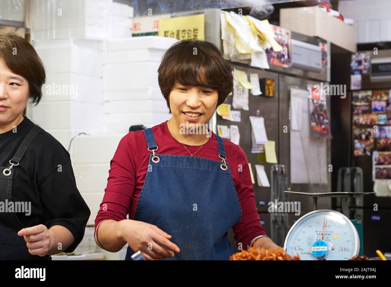 Female Chef Prepares Food In Kitchen For Sale At Gwangjang Market In