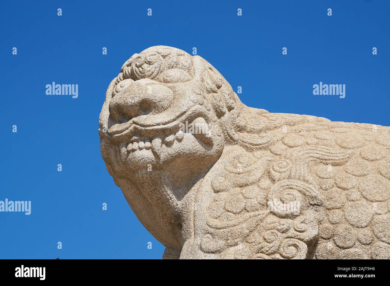 Korean Lion dog guardian (Haetae or haechi) statue on clear blue sky background Stock Photo - Alamy