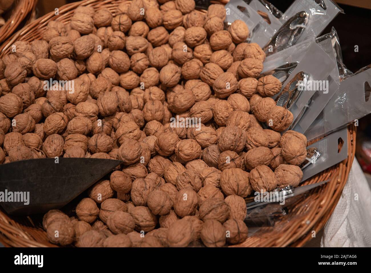 Pile of walnuts in a barrel and scoop Stock Photo - Alamy