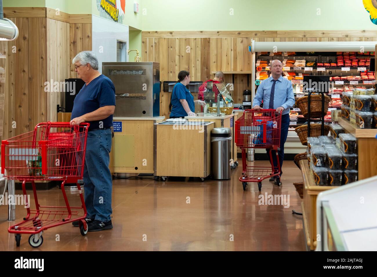 Male shoppers with carts in Trader Joe’s market, Bradley Fair shopping ...