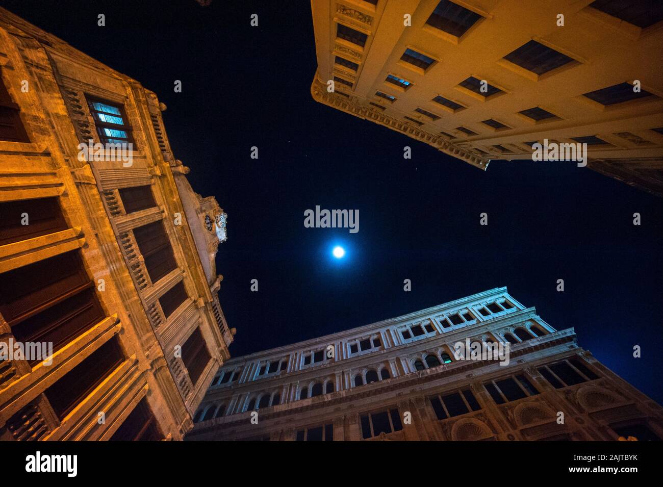 Full moon in the night sky over buildings in central Havana, Cuba Stock ...