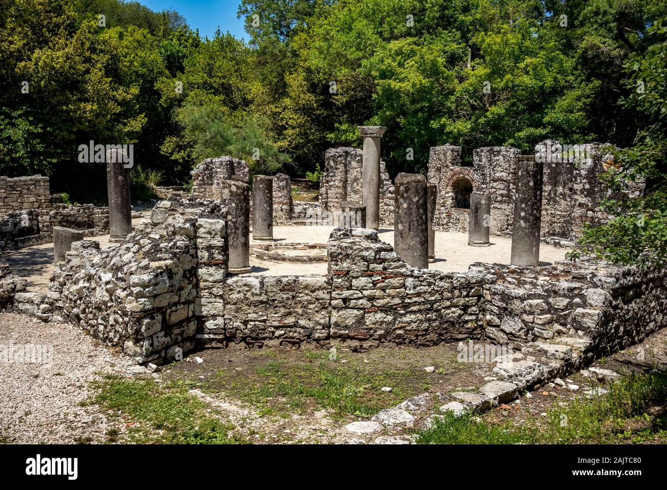 Ruined round ritual place with columns. Beautiful warm spring day and ...