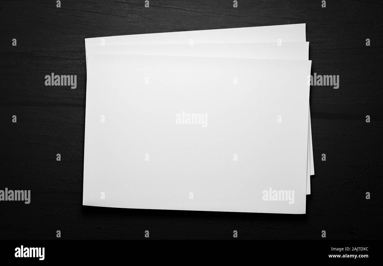 empty blank horicontal sheets isolated on dark wood background to ...