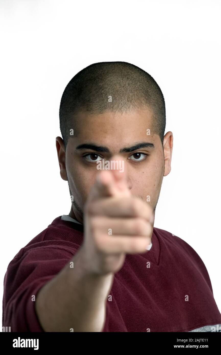 Latino Male Pointing Finger Like A Gun portrait on a white background ...