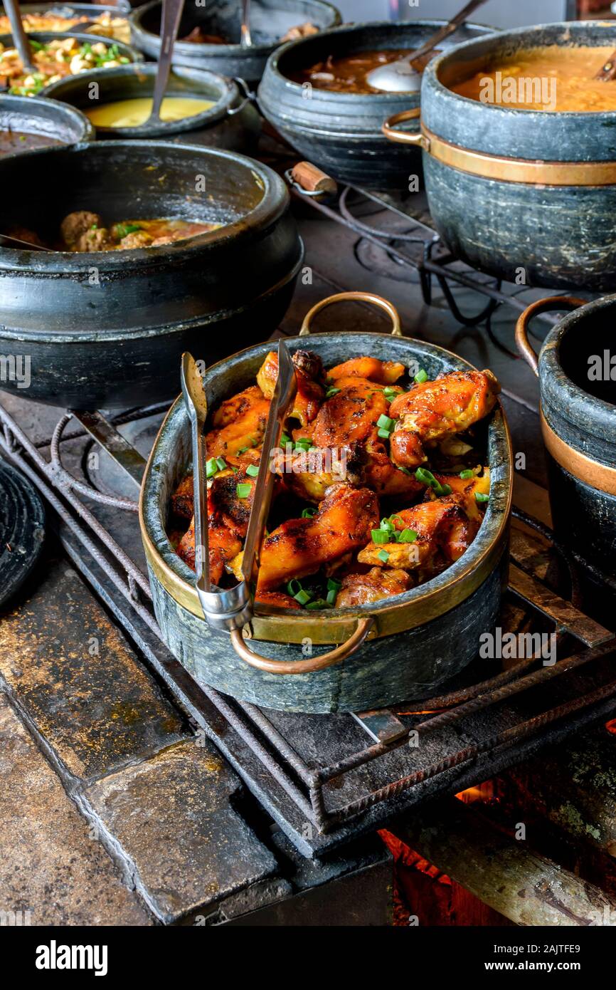 Traditional Brazilian food being prepared in clay pots and in the old ...
