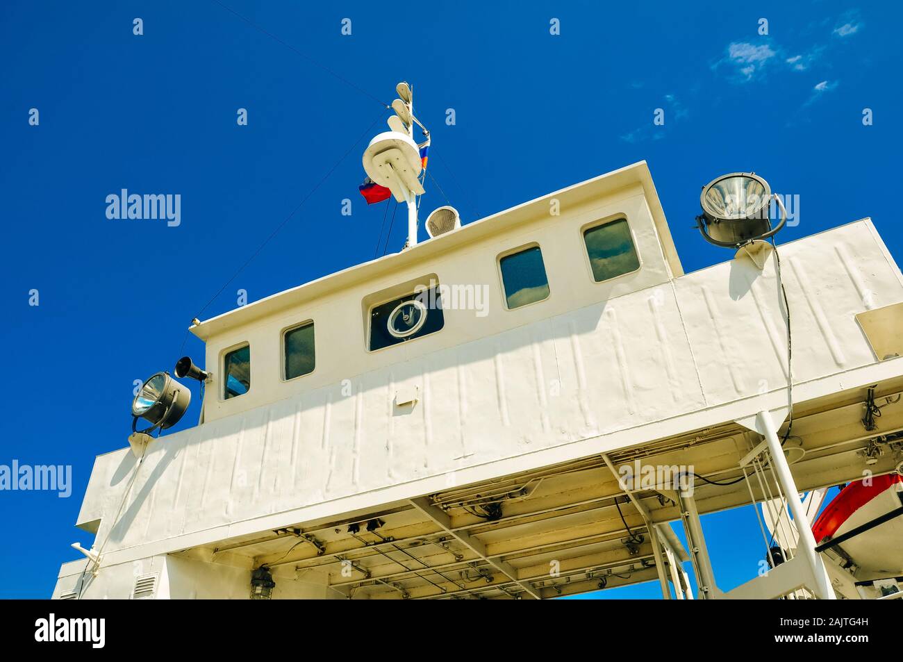 A detail part of a big sea ferry, the captain bridge during the hot ...
