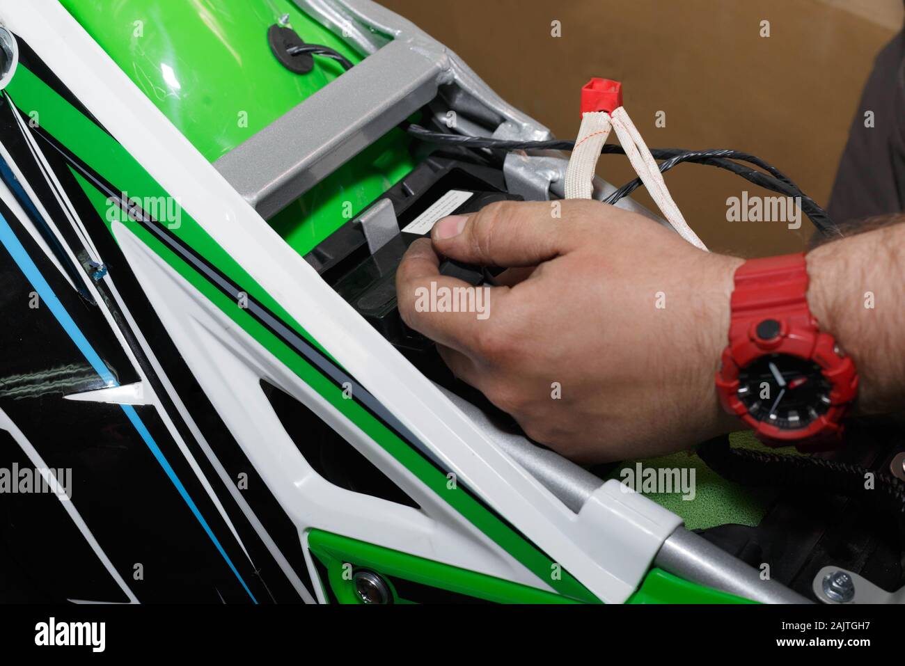 The wizard installs a new battery on the motorcycle after refueling and ...