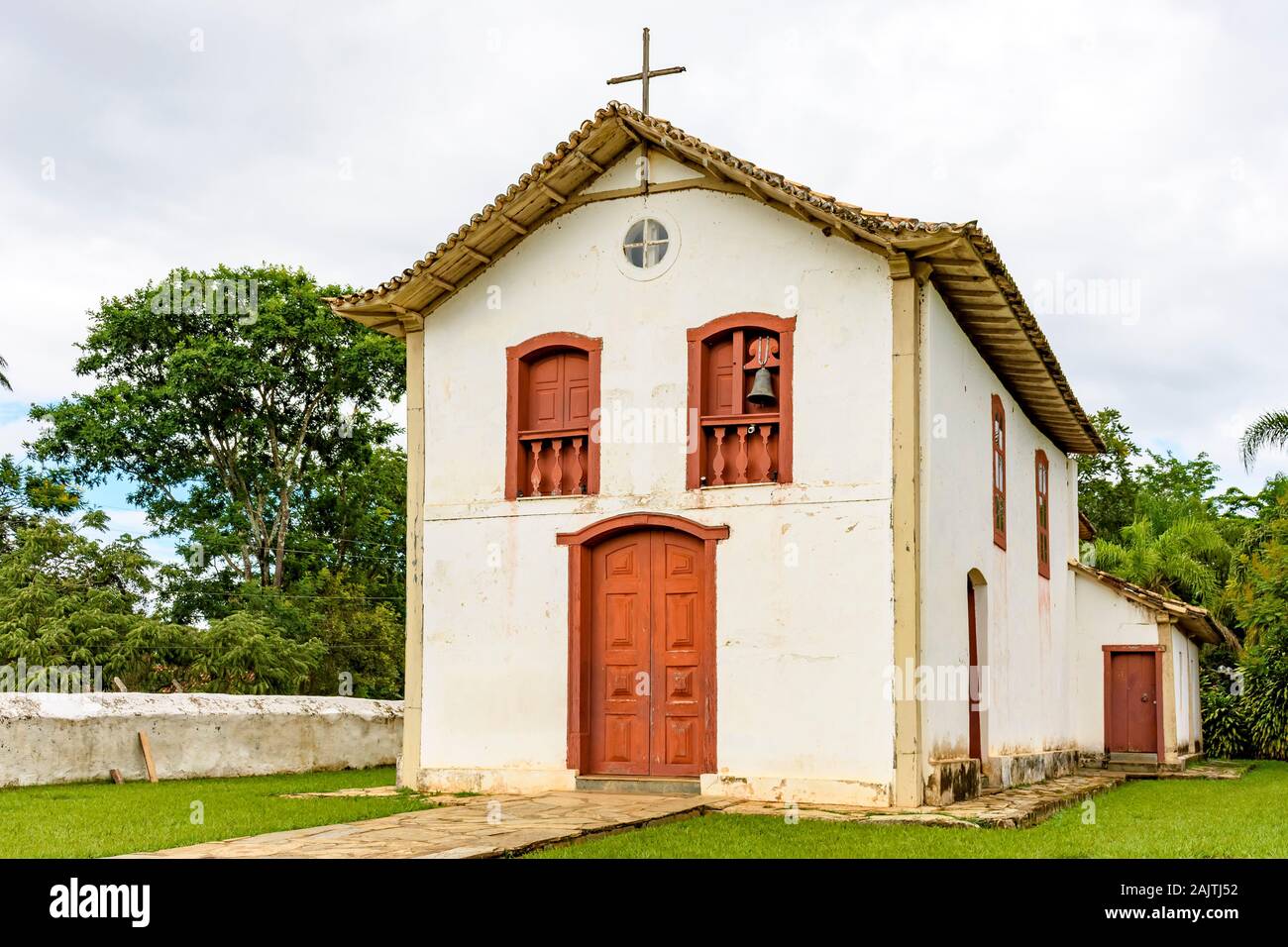 Small and old church and crucifix in colonial architecture in the ...