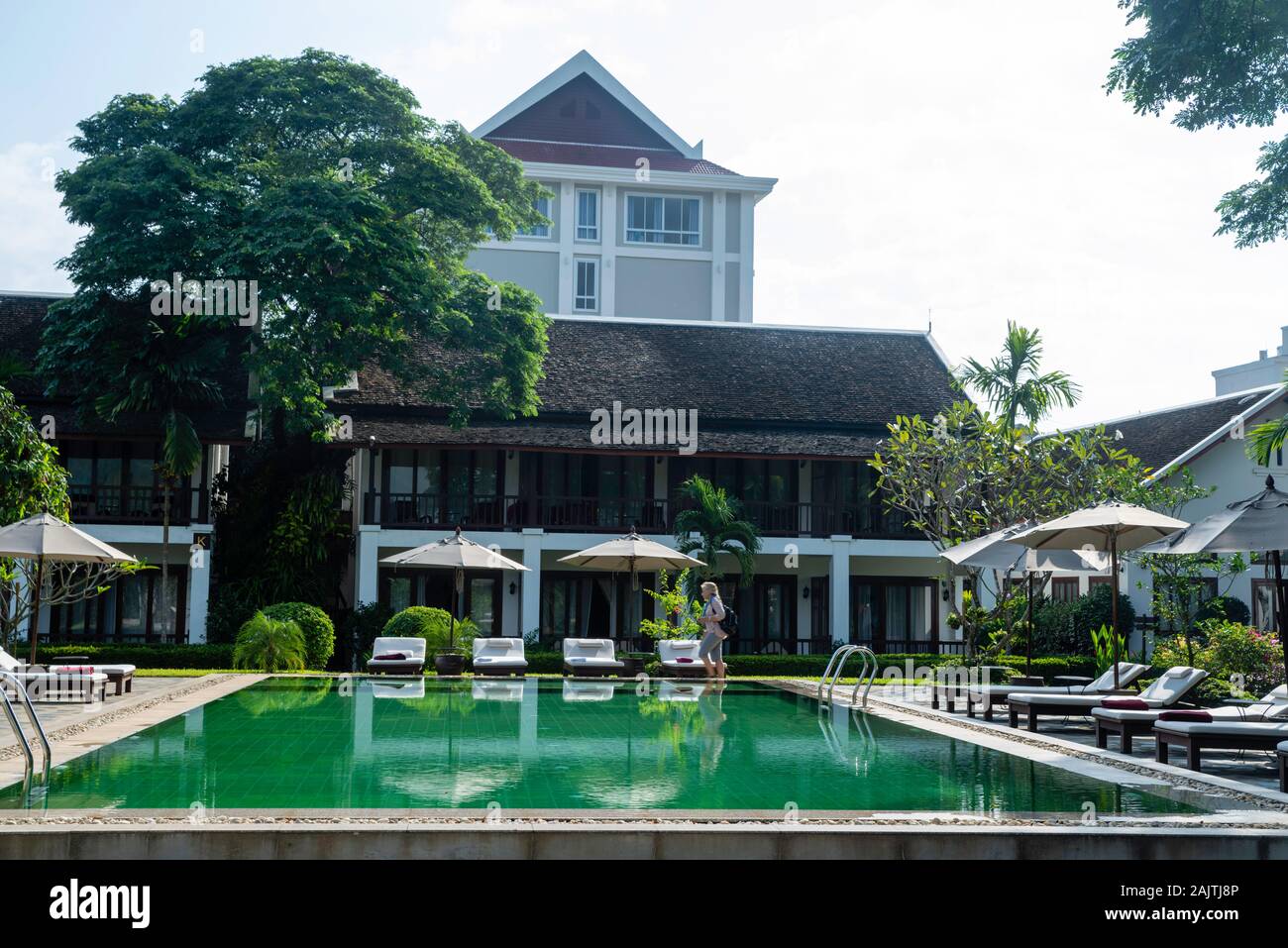 View of the Riverside Boutique Resort and its pool, Vang Vieng, Laos ...