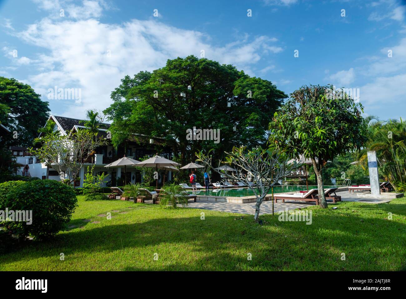 View of the Riverside Boutique Resort and its pool, Vang Vieng, Laos ...