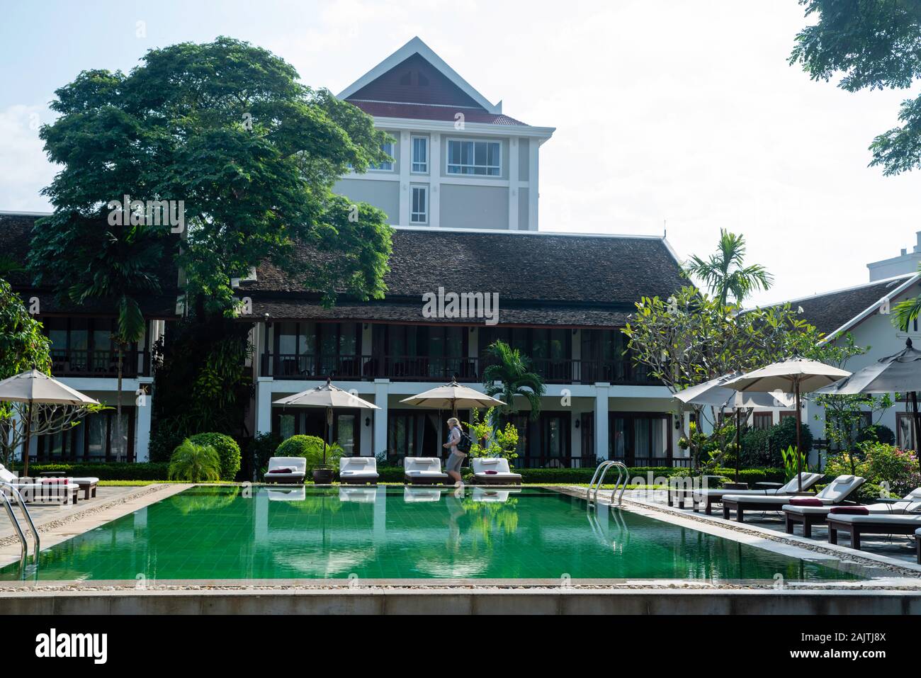 View of the Riverside Boutique Resort and its pool, Vang Vieng, Laos ...