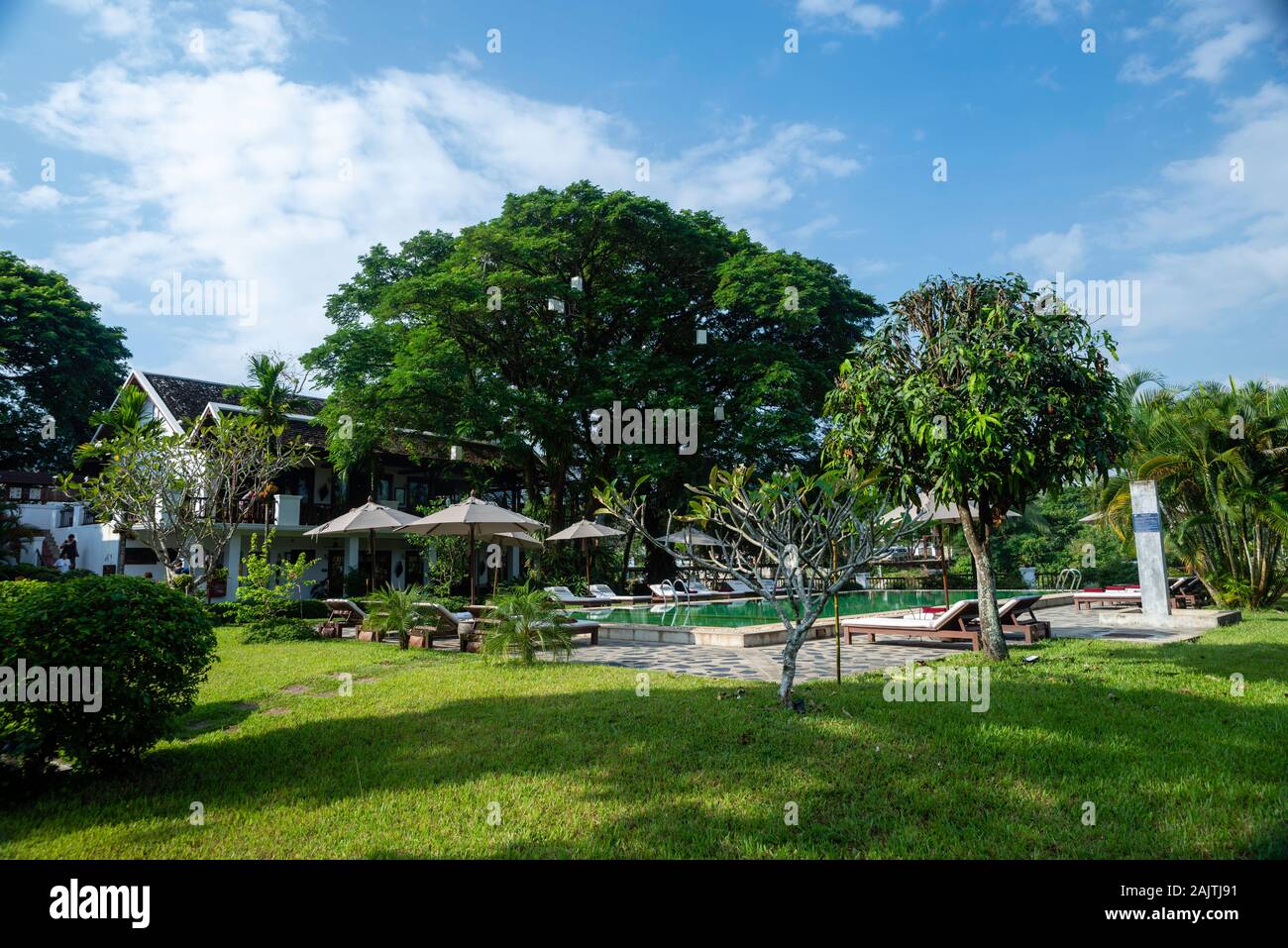 View of the Riverside Boutique Resort and its pool, Vang Vieng, Laos ...