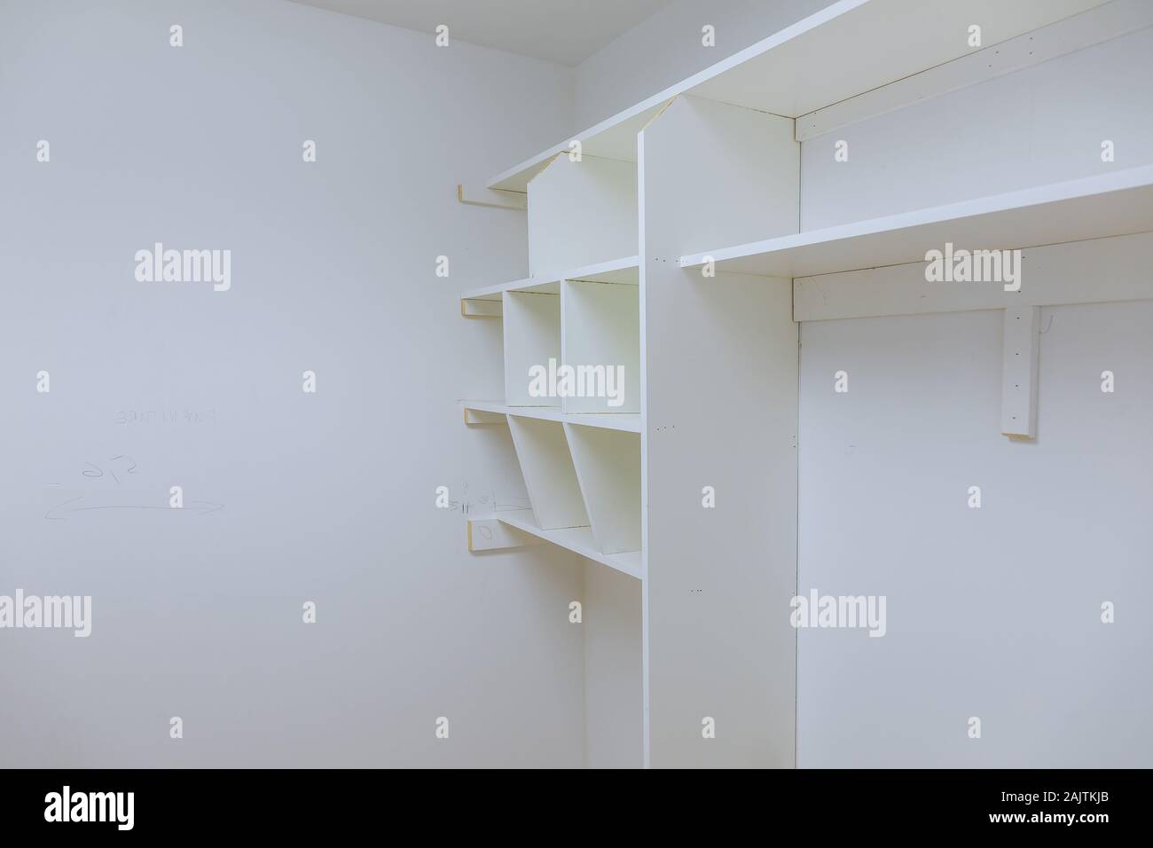 Installation new home interior of white shelf or clothing with many ...