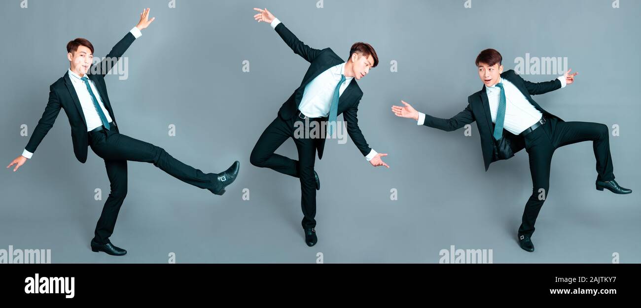 Young man motion happy suit hi-res stock photography and images - Alamy