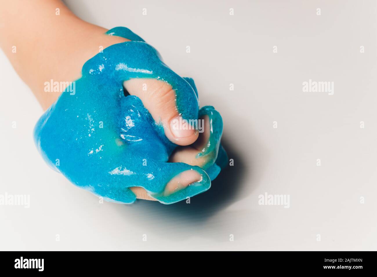 Kid Playing Hand Made Toy Called Slime Alien drool Shell mussel Stock ...