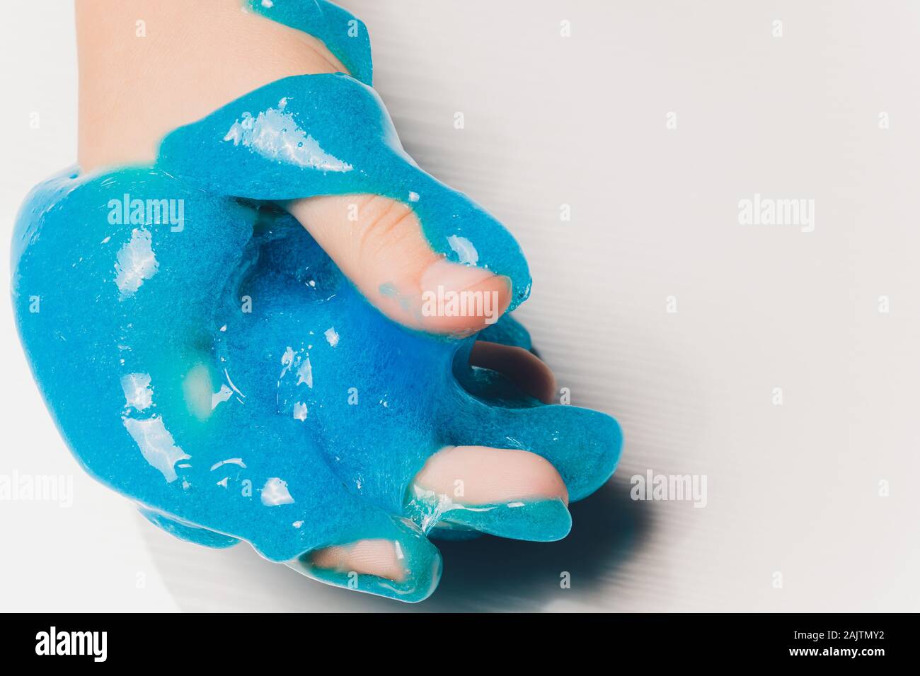 Kid Playing Hand Made Toy Called Slime Alien drool Shell mussel Stock ...