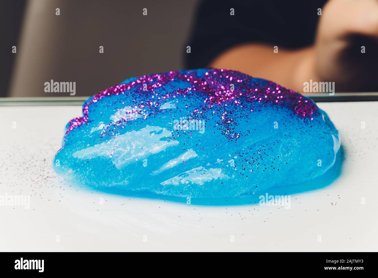 Kid Playing Hand Made Toy Called Slime Alien drool Shell mussel Stock ...