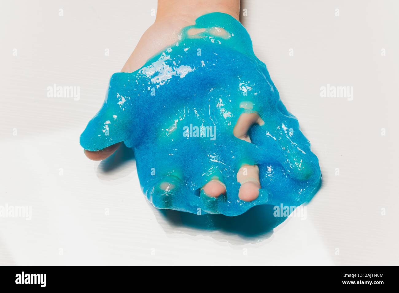 Kid Playing Hand Made Toy Called Slime Alien drool Shell mussel Stock ...