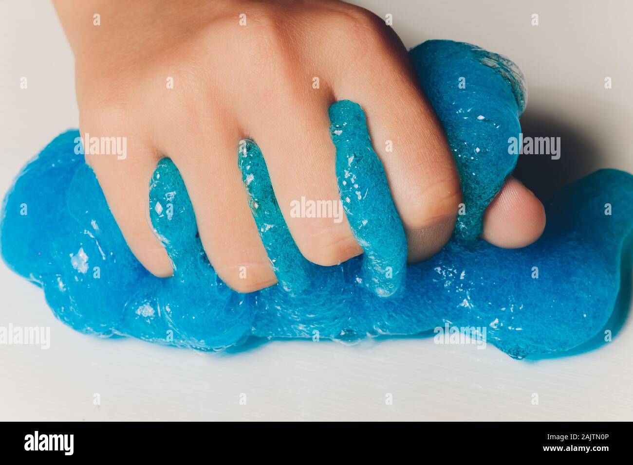 Kid Playing Hand Made Toy Called Slime Alien drool Shell mussel Stock ...