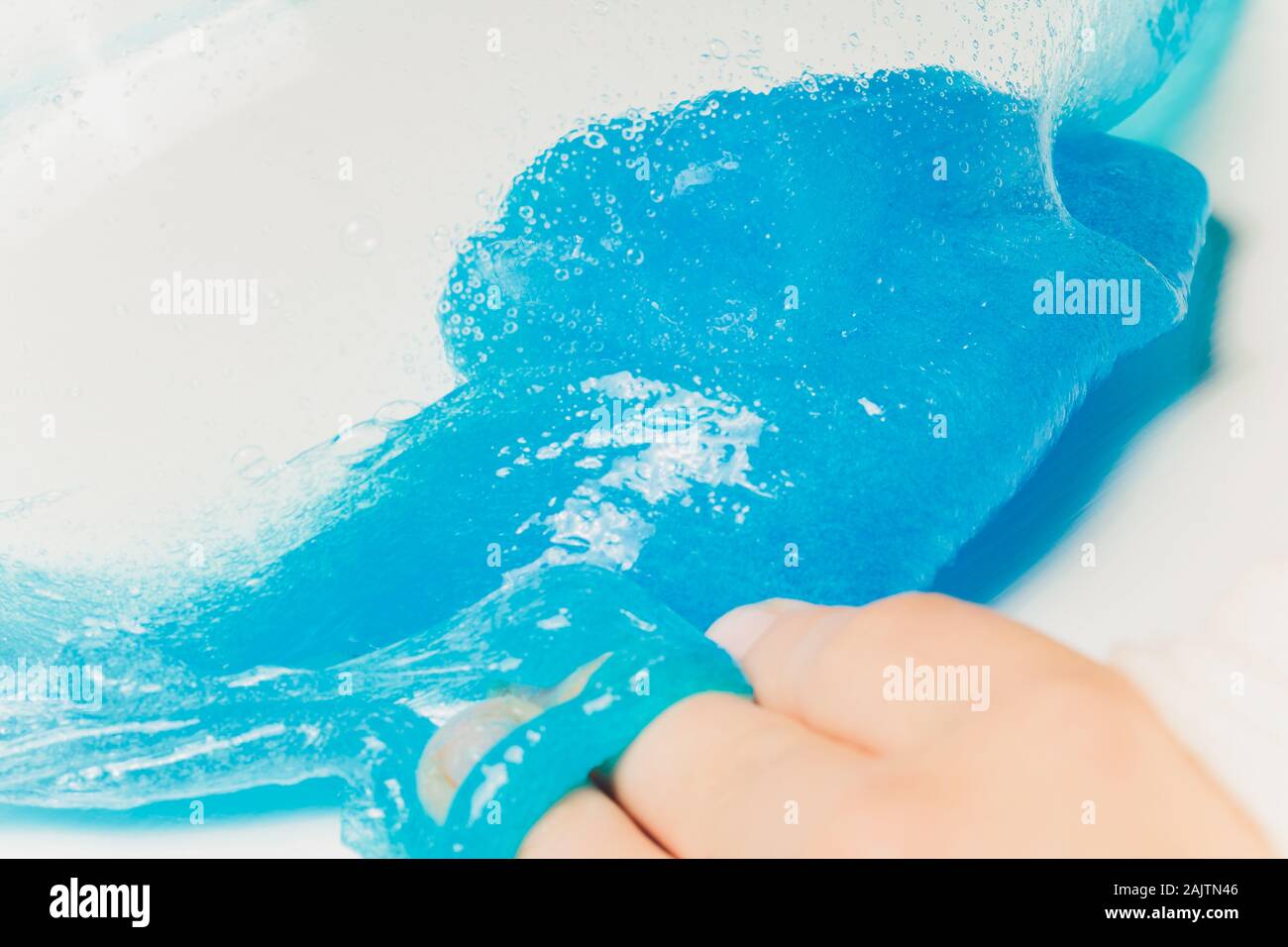 Kid Playing Hand Made Toy Called Slime Alien drool Shell mussel Stock ...