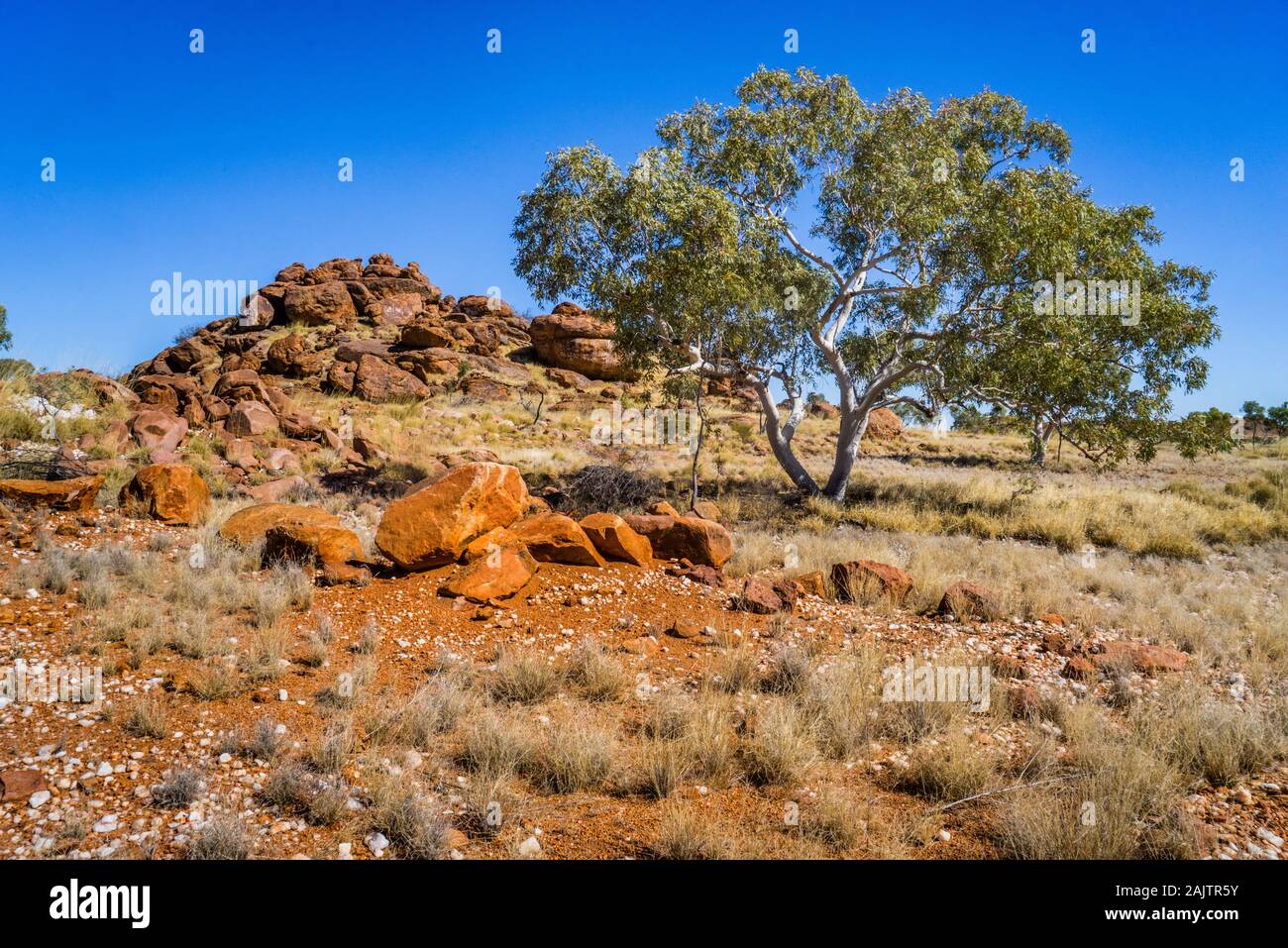 boulders in the outback bush landscape south of Mount-Isa along the ...