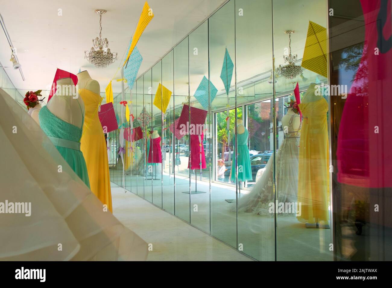 Colorful dresses in a shopfront window Stock Photo - Alamy