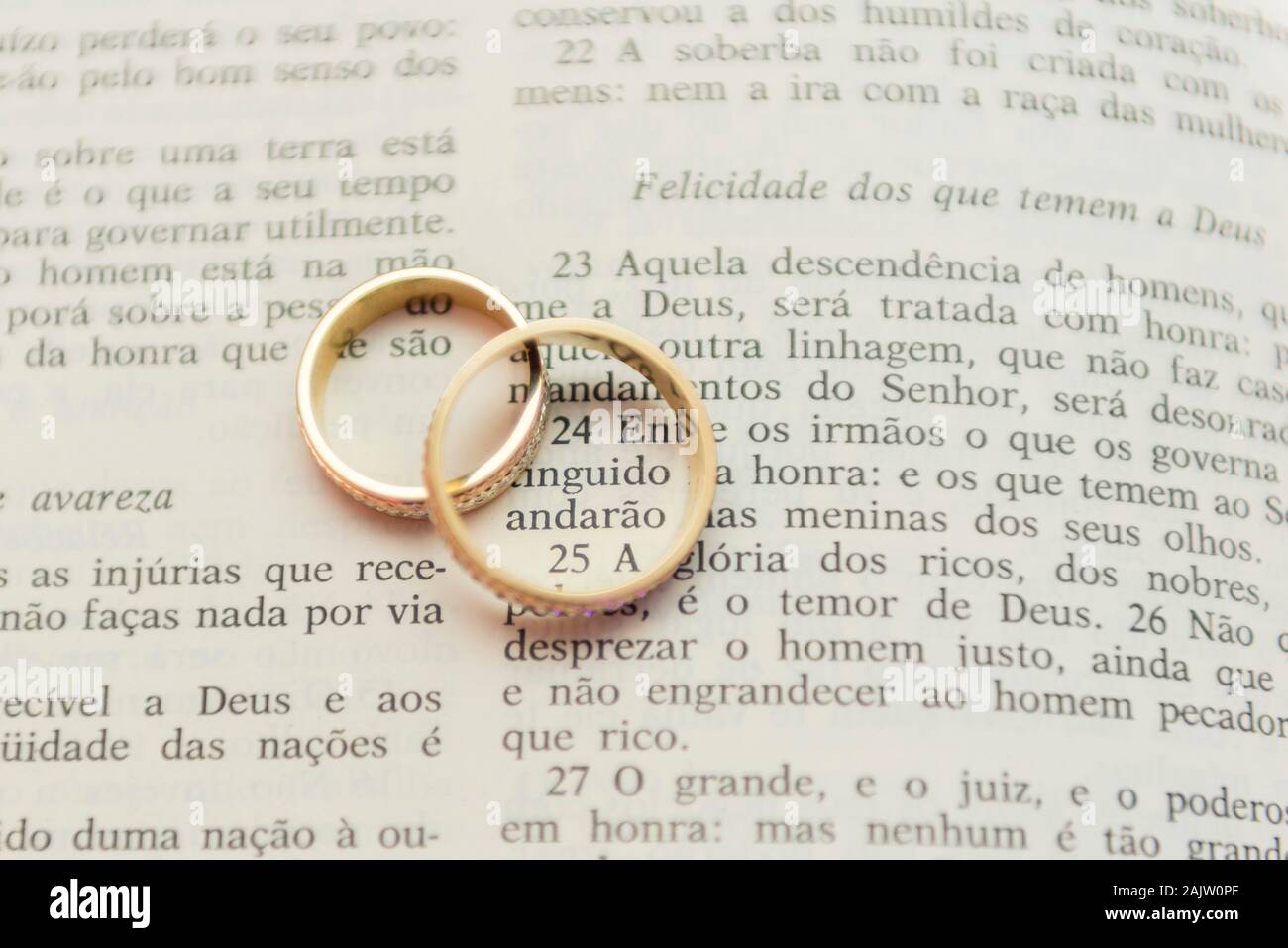 Wedding rings on a holy bible "Bíblia Sagrada". Concept of union, love ...