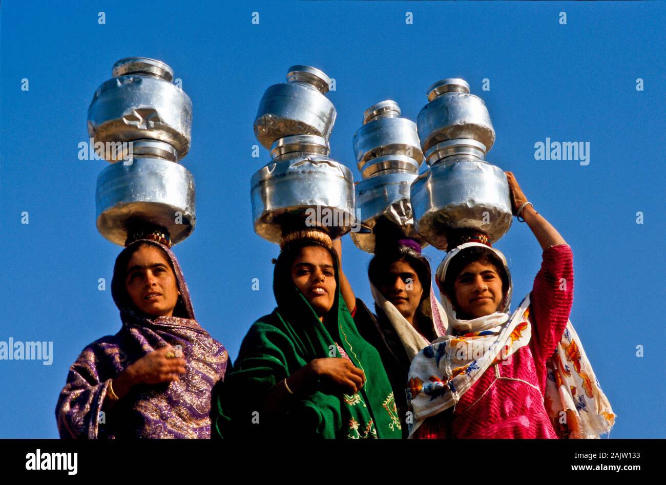 Indian women carry water pots hi-res stock photography and images - Alamy