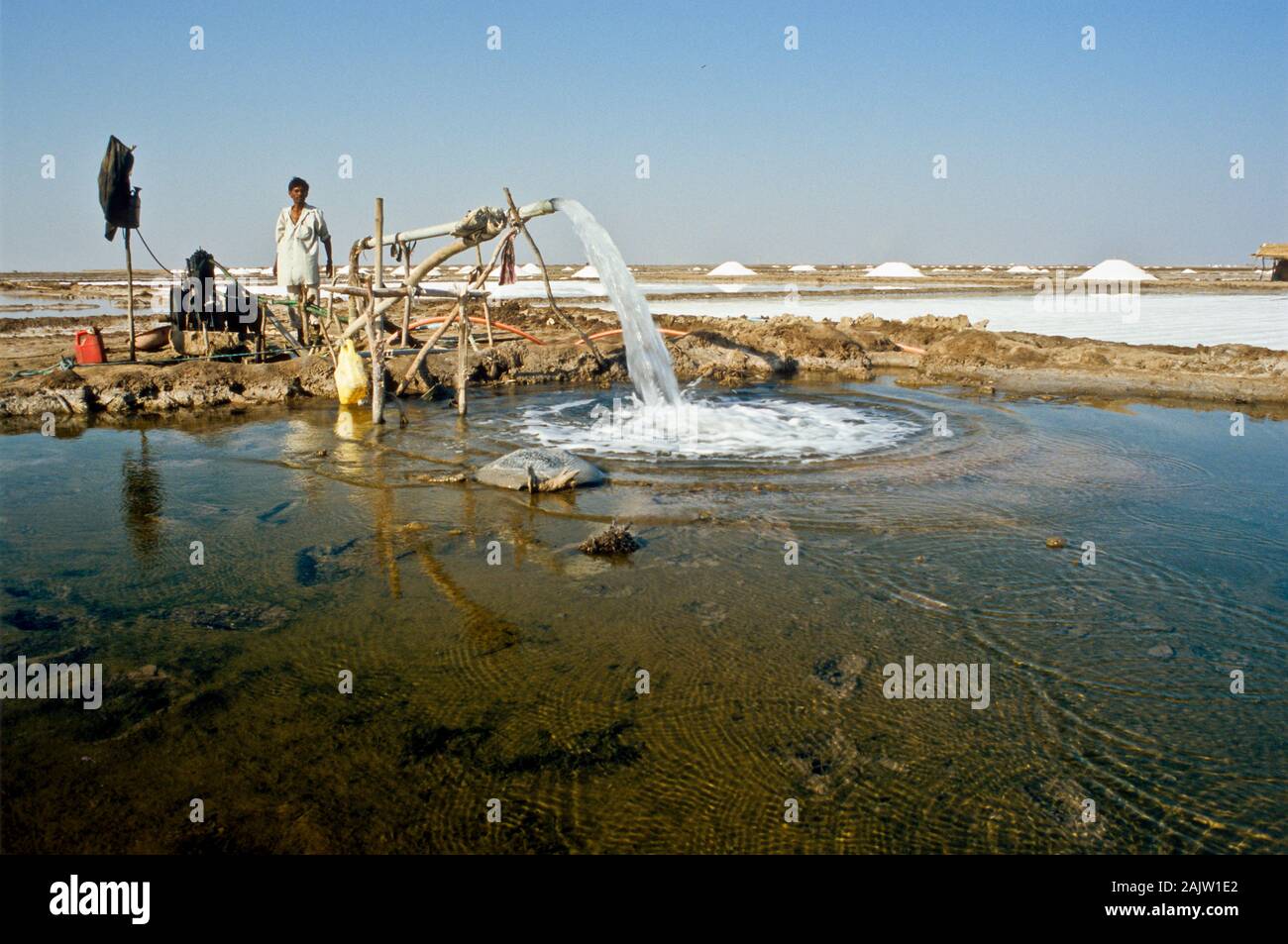 Old man pumping water pump hi-res stock photography and images - Alamy