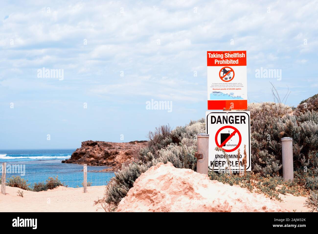 Signs "Danger" and "Taking shellfish prohibited" on a beach, Beachport ...