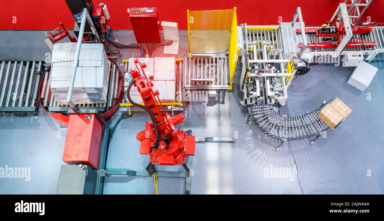 robotic arm at production line with automatic conveyor belt, industry ...